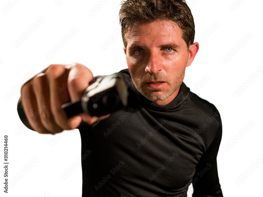 action portrait of angry and attractive hitman or special agent man ...