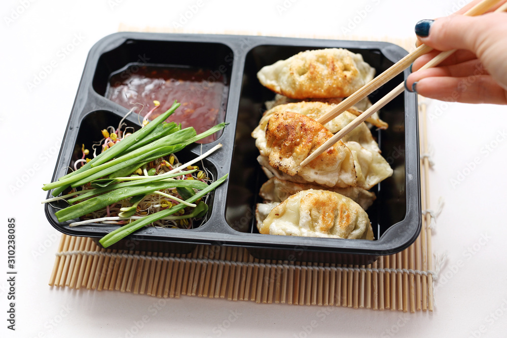 Gold fired dumplings fried with soy sauce and salad. Ready food from ...