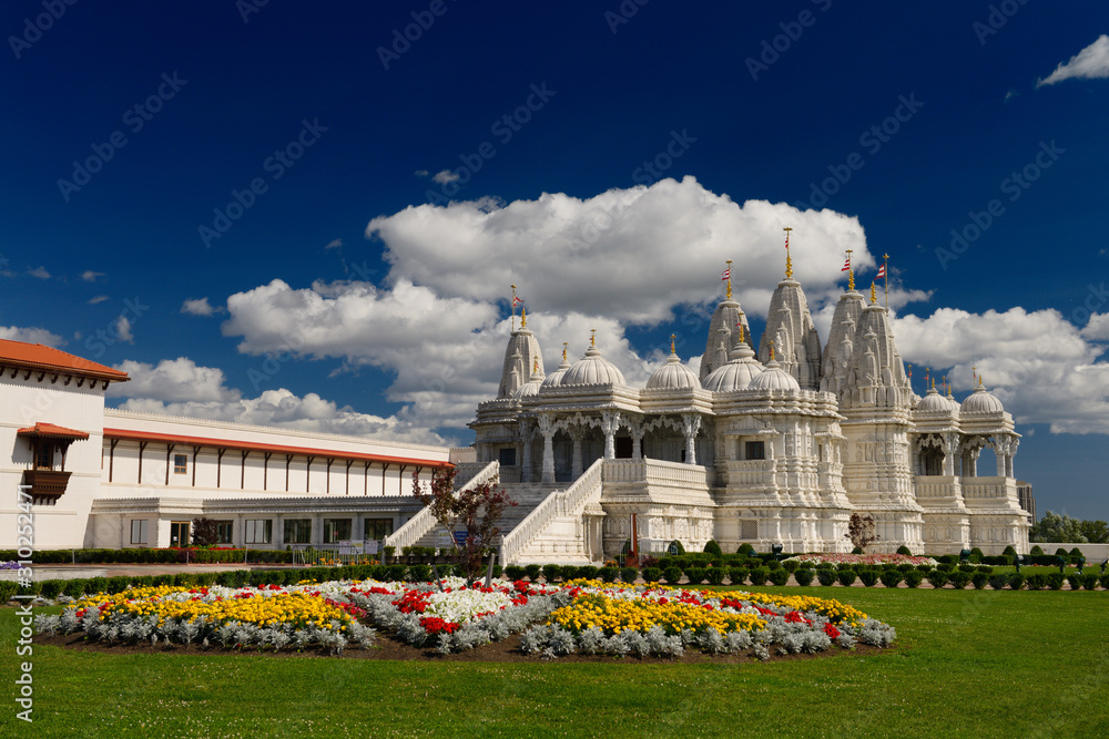 BAPS Shri Swaminarayan Mandir Hindu Temple Complex with flowers on a ...
