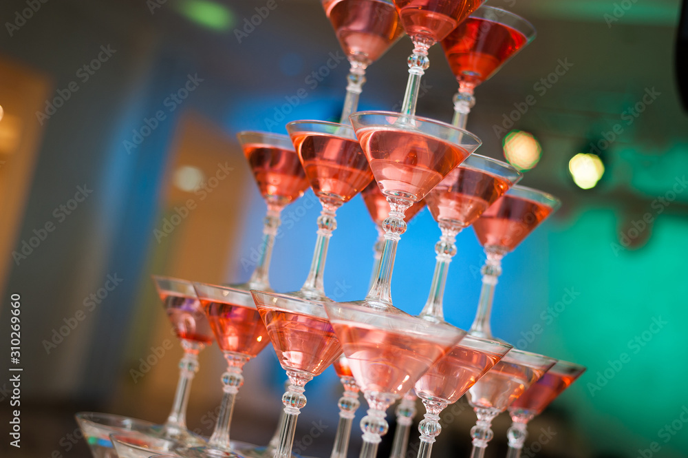 Luxury Banquet table with a pyramid of champagne glasses with cherries ...