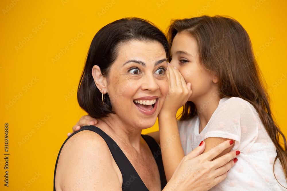 Mom and daughter secretive. kid sharing a secret with mother. Mommy ...