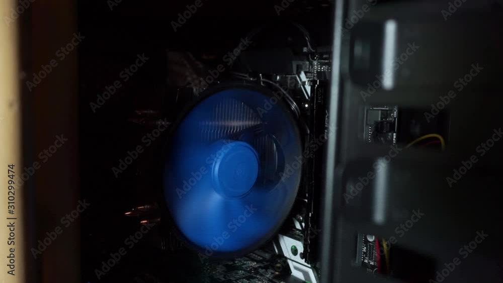 The cooling fan blades of the processor and motherboard are spinning in ...