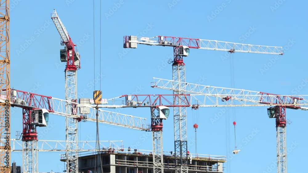 Civil engineering - tower cranes on the construction of the building ...