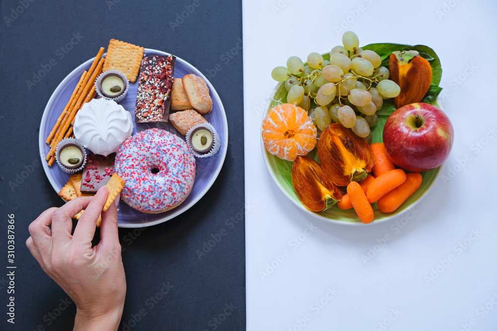 Healthy and unhealthy food concept, fruits and vegetables vs donuts ...