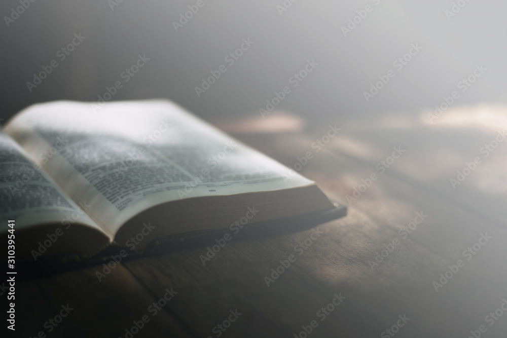 Soft focus Open holy bible on wood table with copy space. Stock Photo ...