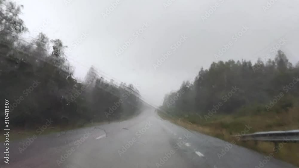 Driving through heavy rain storm dramatic northern scandinavian route ...