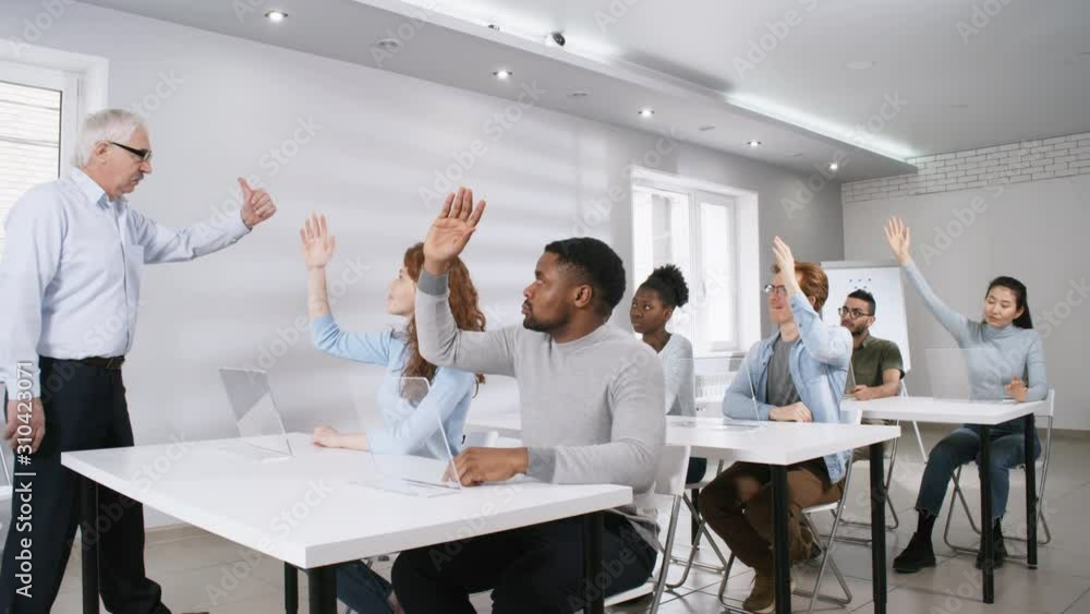 Full shot of elderly Caucasian professor asking questions to ...
