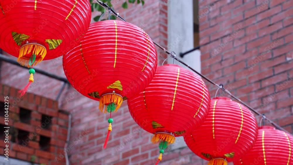 Beautiful round red lantern hanging on old traditional street, concept ...