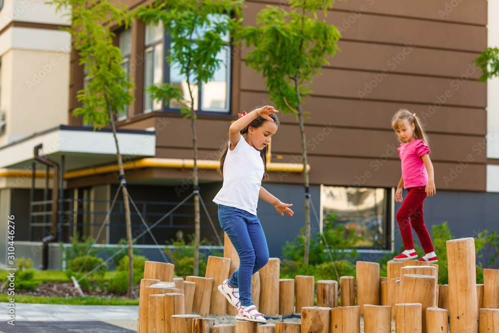 two little girls on the playground Stock Photo | Adobe Stock