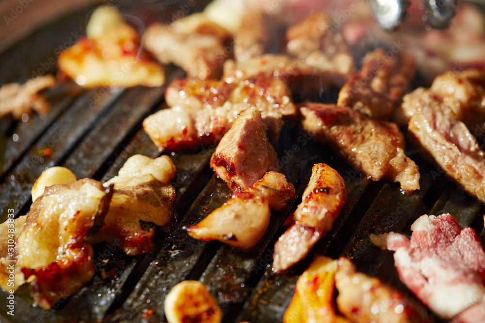 Korean BBQ, meat on iron plate Stock Photo | Adobe Stock