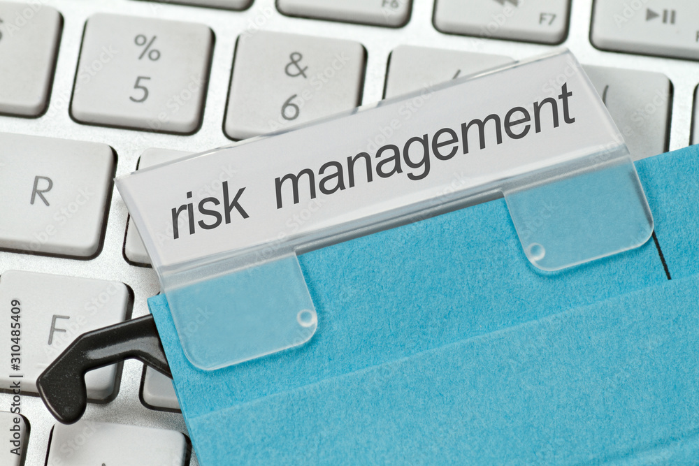 blue hanging file with the term risk management on a PC keyboard Stock ...