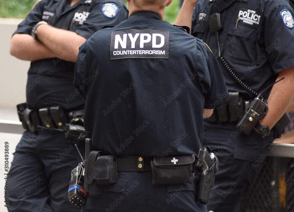 NEW YORK, USA - June 10, 2018: Police officer performing his duties on ...