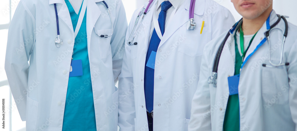 Successful medical team. Confident doctors team standing together and ...