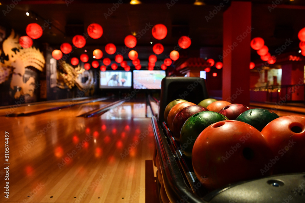 Bowling lane and balls in the row in bowling center. Stock Photo ...