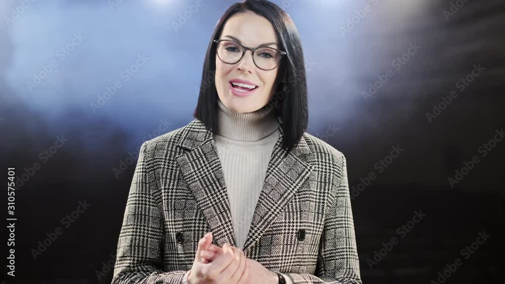 Show woman. Female entertainer, presenter or actor on stage. Arms to ...