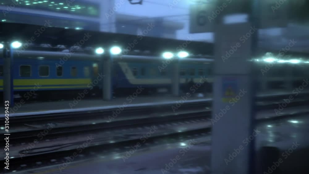Kyiv central railway station at night. Arrival of the train on the ...