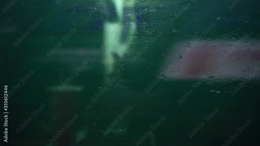 A train passes a long freight train. View from the window. Many wagons ...