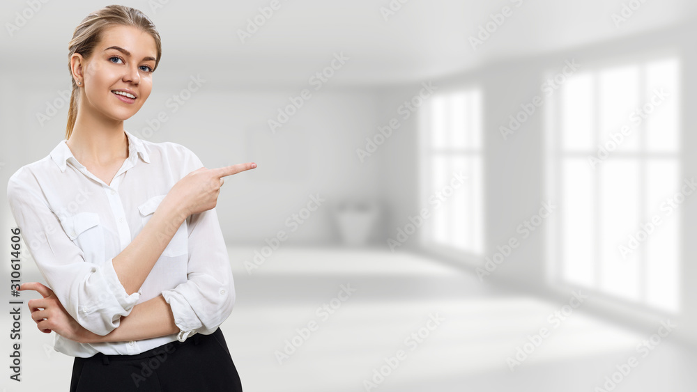 Young business woman pointing by finger to the side. Stock Photo ...