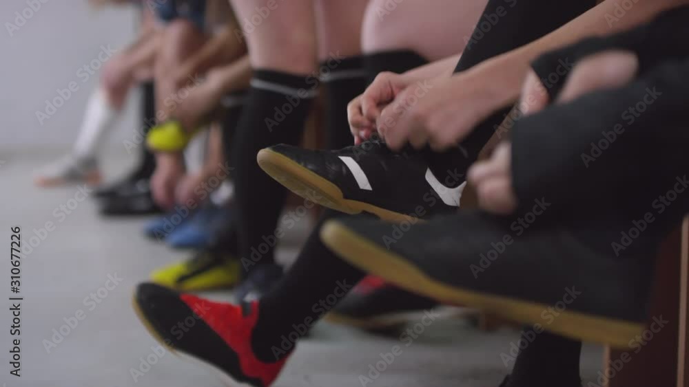 Sequence of shots of group of young female soccer players in sports ...