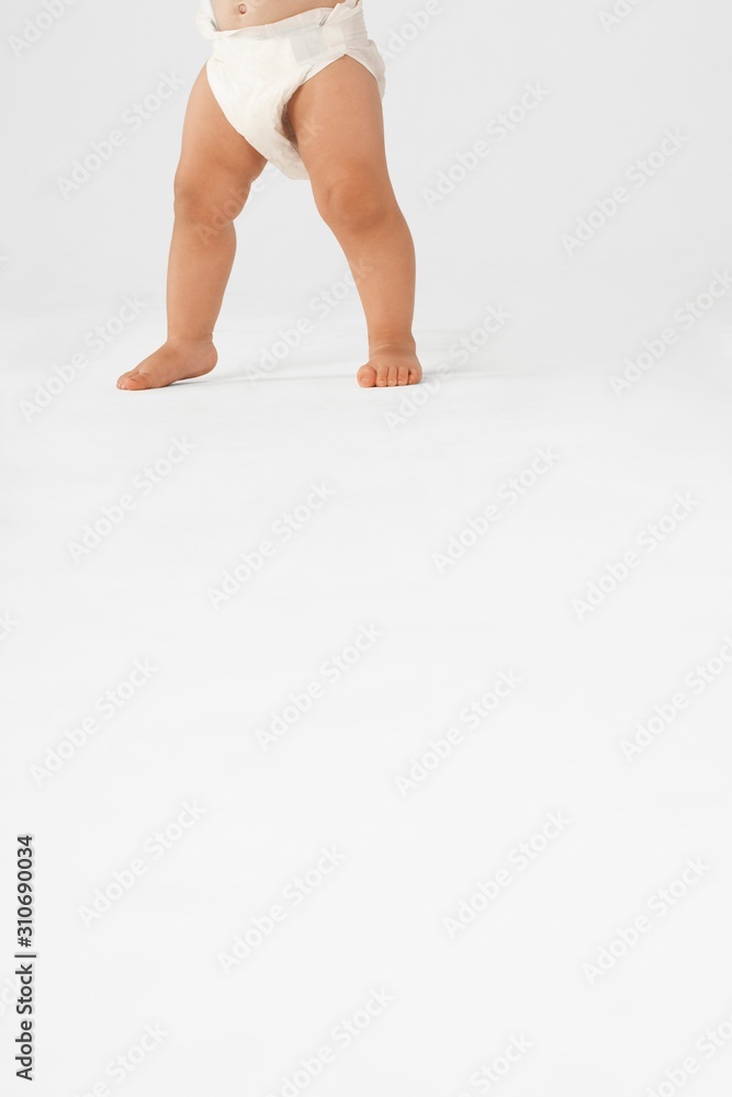 Baby In Diaper Walking Stock Photo | Adobe Stock
