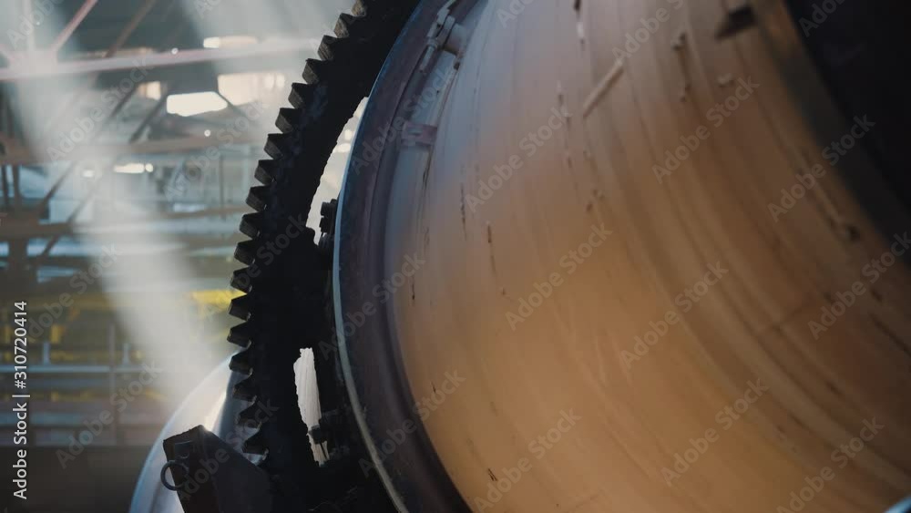 Gears of rotation of a cylindrical furnace. Rotary burning kiln on a ...
