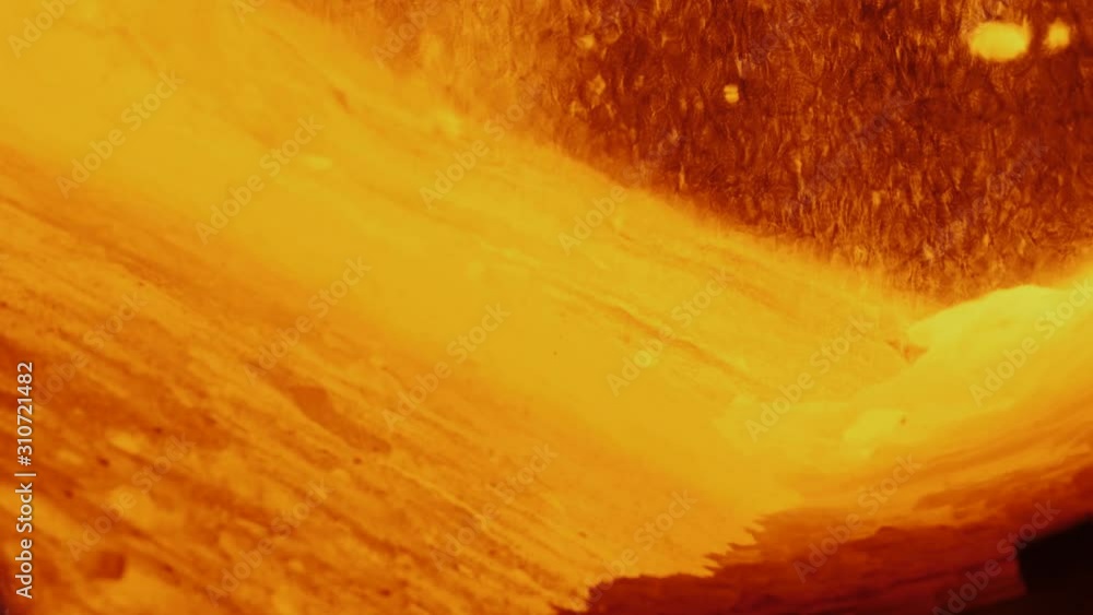 Industrial production process of cement clinker. Oven rotates and hot ...