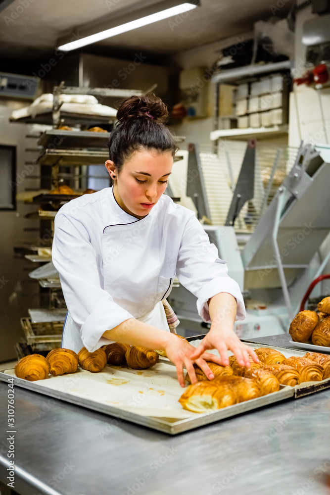 Young Pastry Chef Sorting Freshly Baked Croissants Stock Photo | Adobe ...