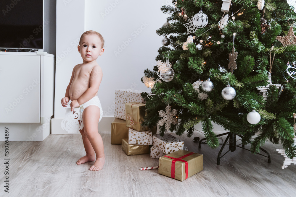cute baby girl wearing diaper decorating Christmas Tree Stock Photo ...