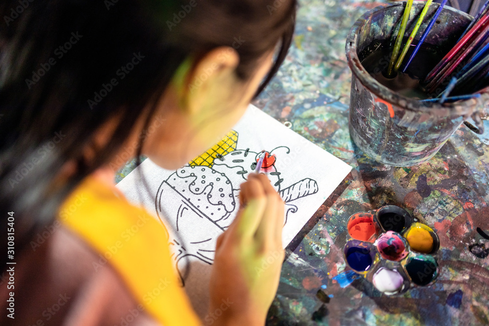 Asian child girl studying and learning the art,happy schoolgirl with ...