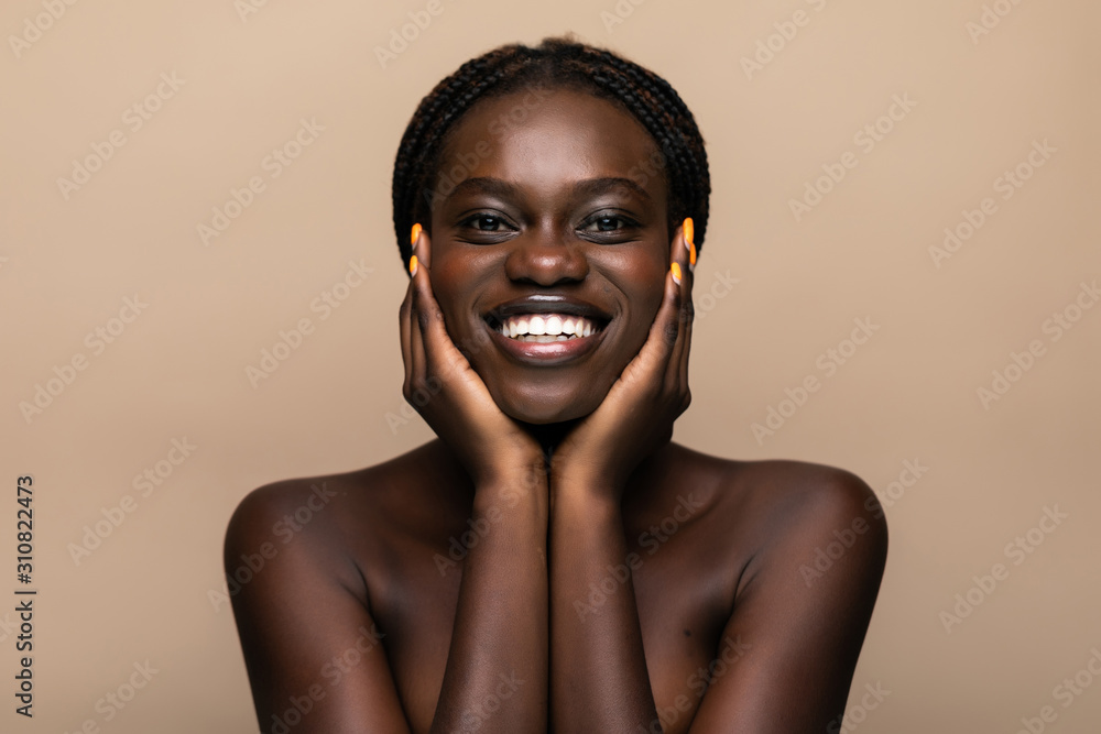 Young african girl with perfect skin on beige background. Beauty Skin ...