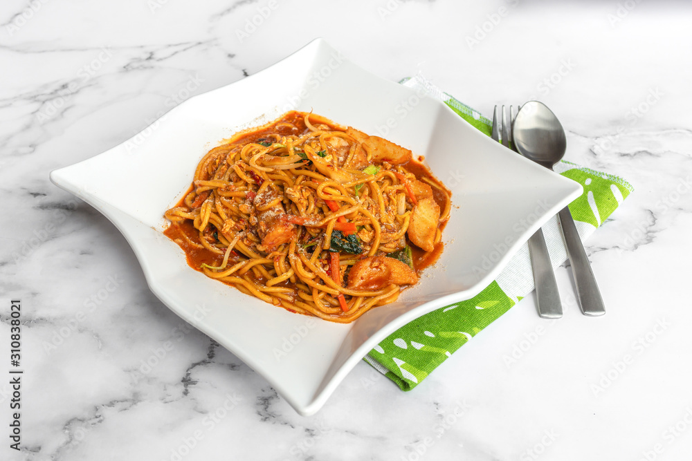 Mee goreng, an Asian Malay spicy fried noodle dish, originating from ...
