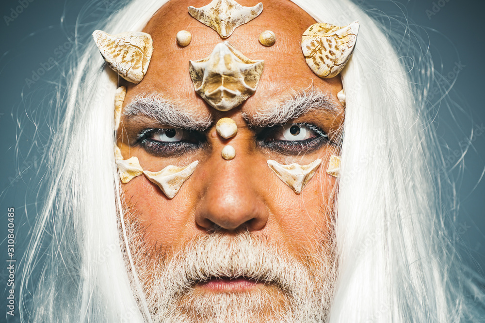 Burning diabolic demon summons evil forces and opens hell. Elderly man ...
