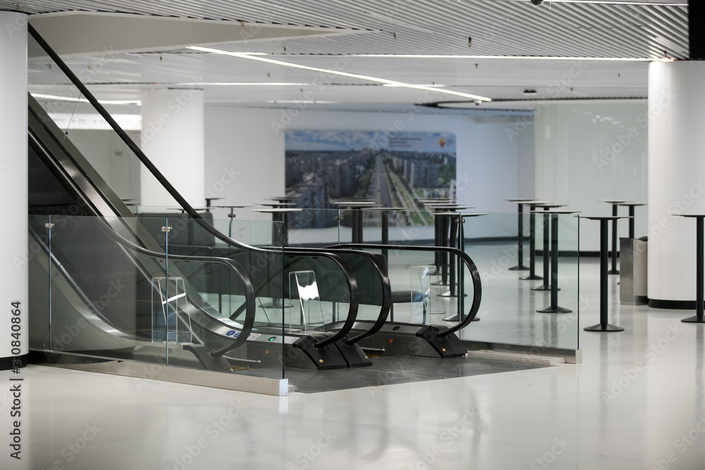 Escalator in Community Mall, Shopping Center. Moving up staircase ...