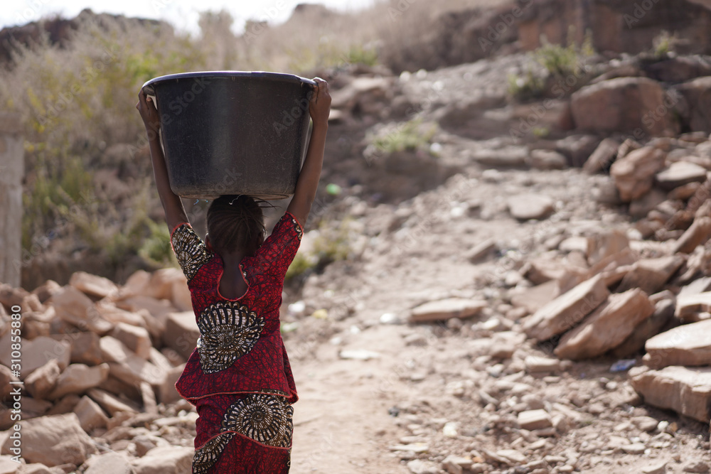 Portrait of Gorgeous African Girl Carrying Heavy Water Bucket Stock ...