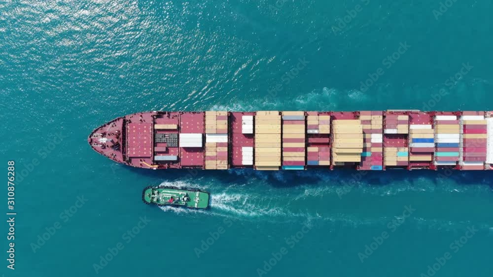 Aerial of cargo ship carrying container and running for export goods ...