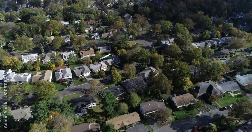 Iconic 4K aerial of a typical American suburbs neighborhood in summer ...