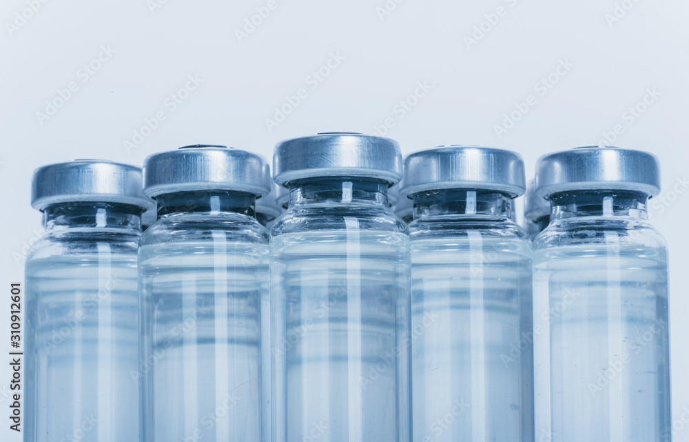 Glass medical ampoule vial for injection. Medicine is dry white drug ...