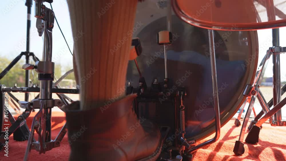 Bass drum and shoe of musician playing music and sing song, blurred ...