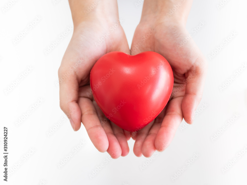 Cute red heart in two palms hand for take care of your good health from ...