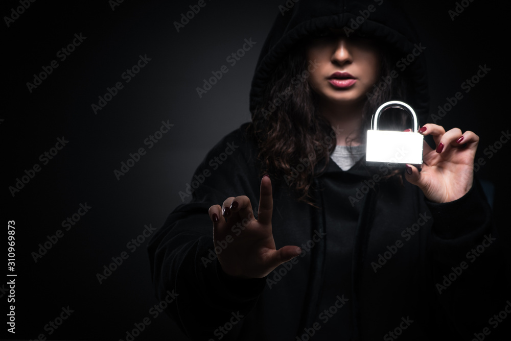 Female hacker hacking security firewall late in office Stock Photo ...