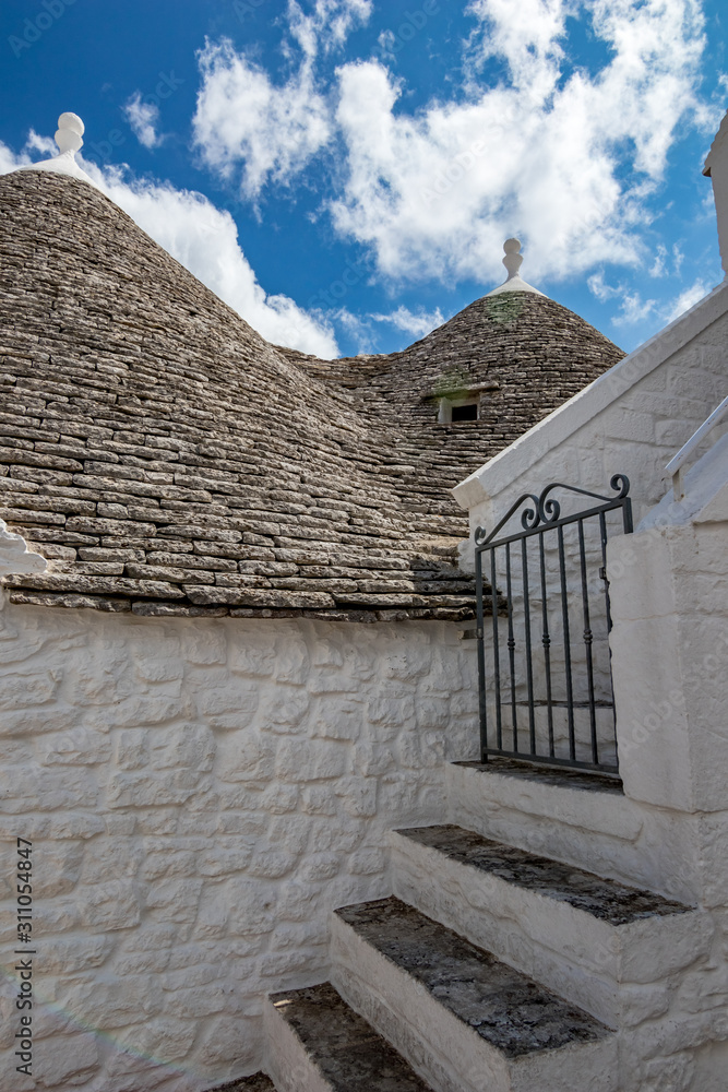 Roofs of truli, typical whitewashed cylindrical houses in Alberobello ...