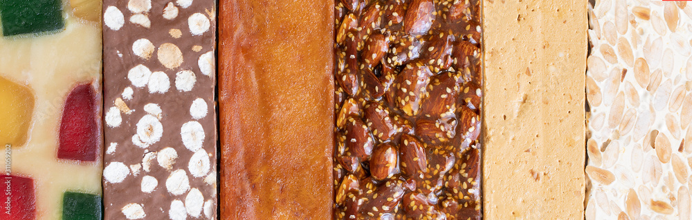 Different Spanish turron or nougat, hard almond, soft almond, chocolate ...