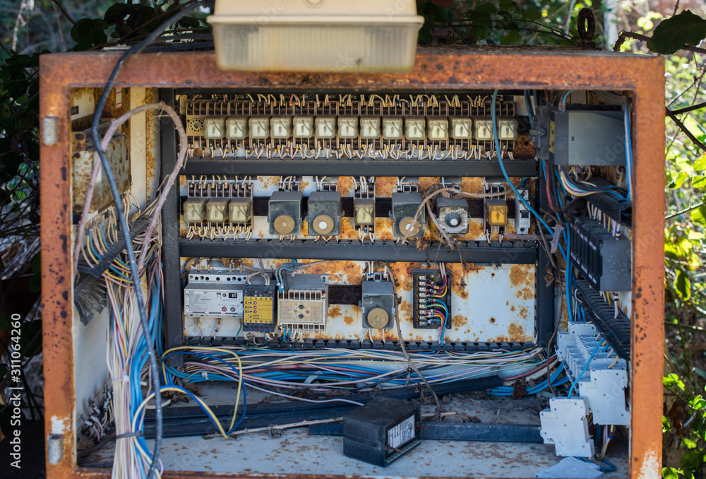 Rusty electric box with fuses and wires in the dump outside Stock Photo ...