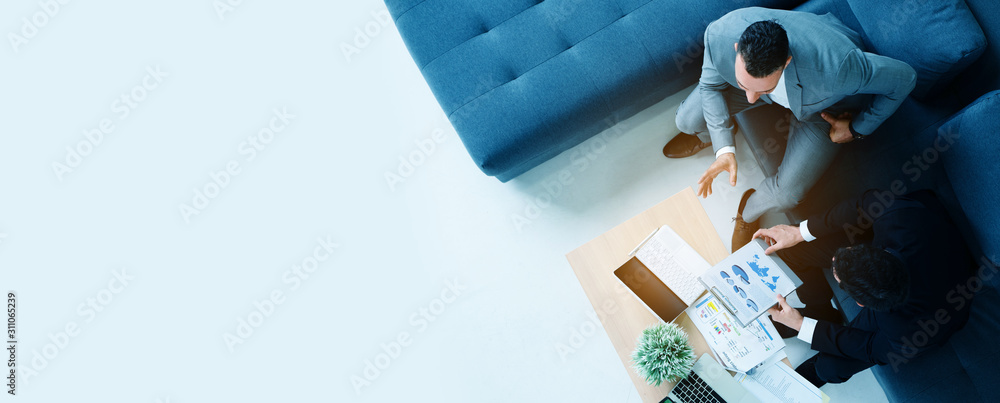 Top view, two businessmen sitting in the office talking about marketing ...