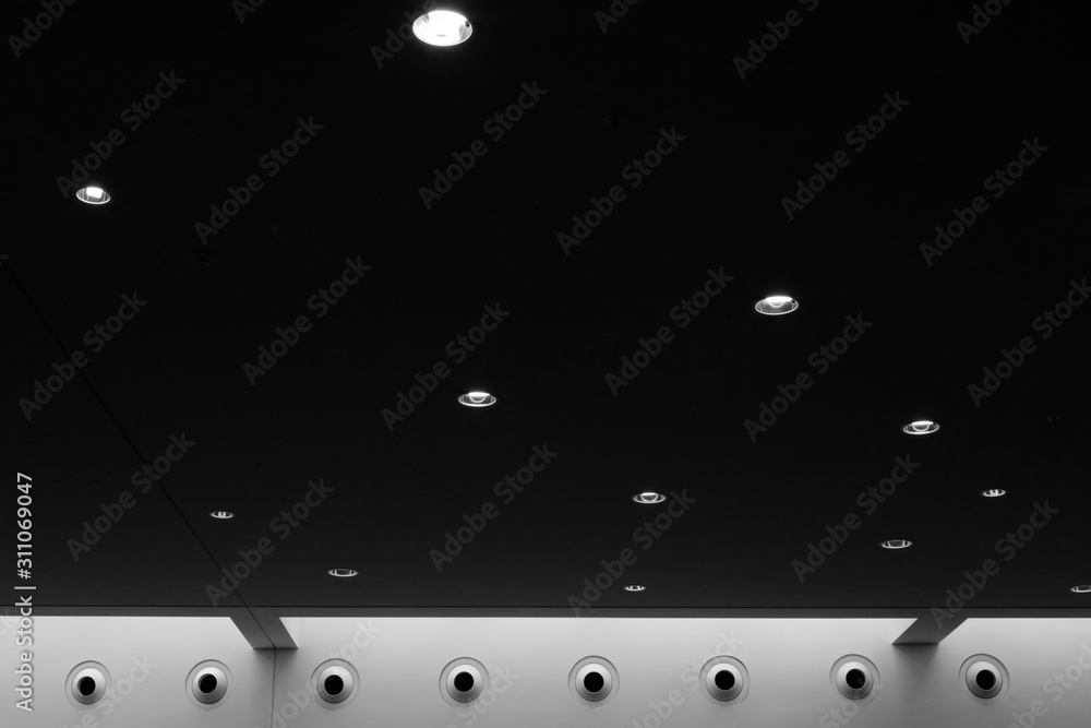 Ceiling with spot lights and air ducts of ventilation system. Close-up ...