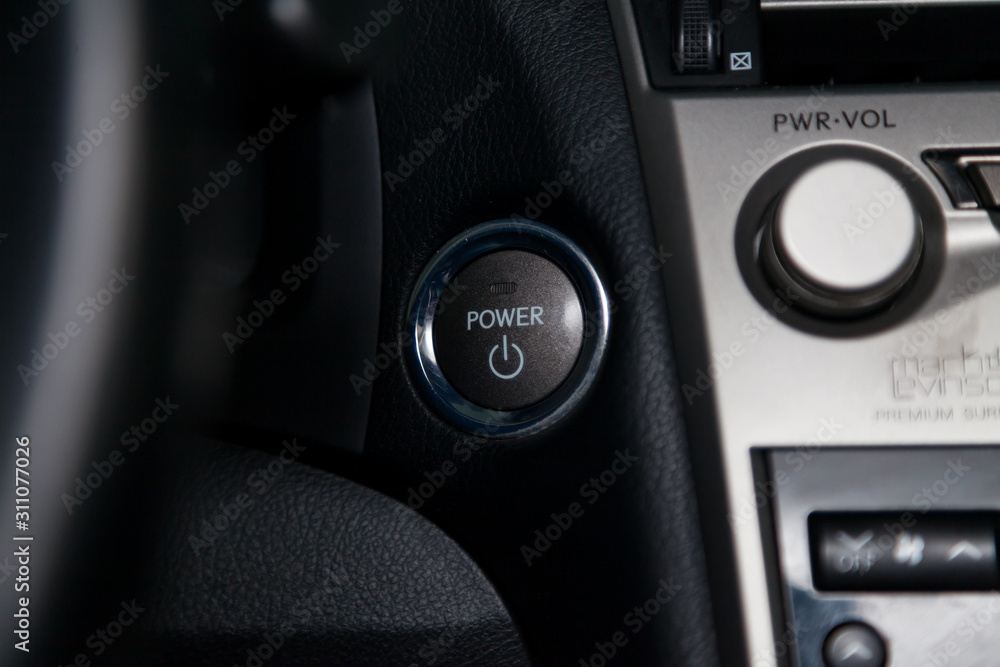 Button start and turn off the ignition of the car engine close-up on ...