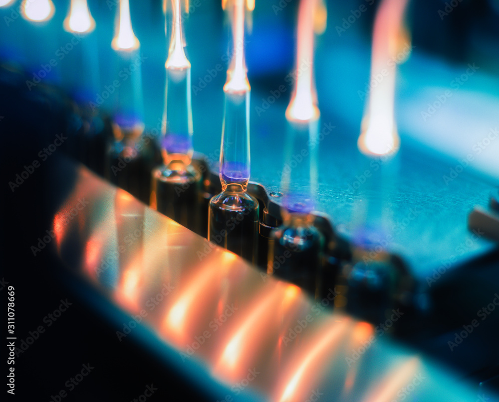 pharmaceutical ampoules for Covid19 vaccine being desinfected and ...