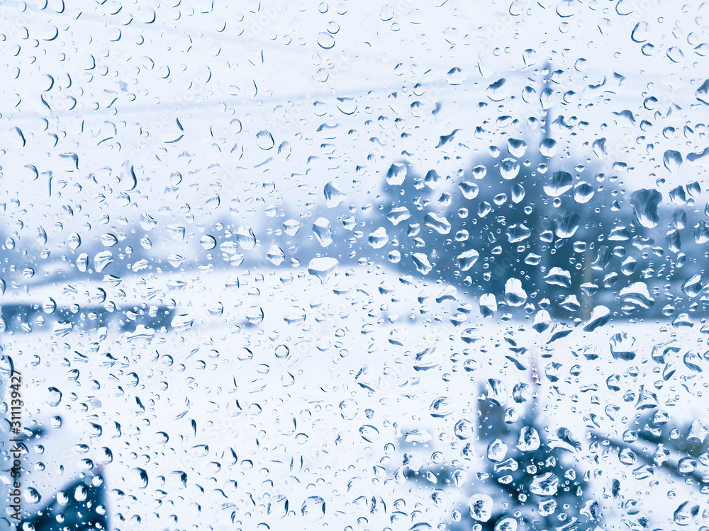 Waterdrops of rain on surface transparent window after heavy rainy cold ...