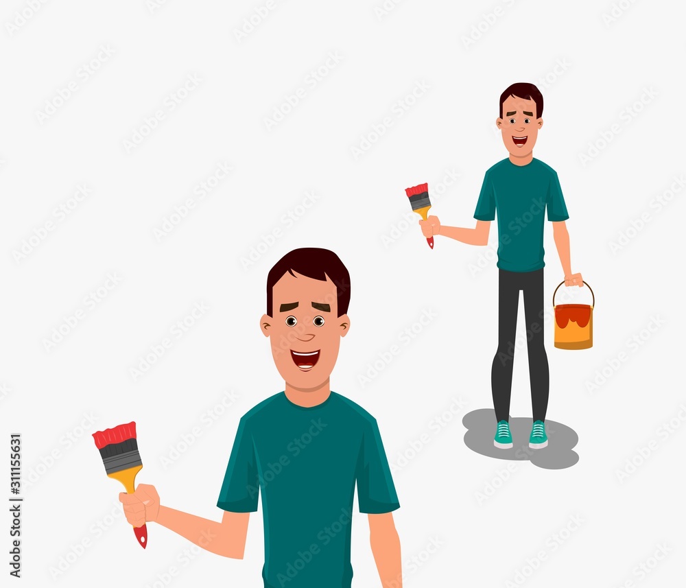 Painter standing with holding paint brush in hand. Young painter ...