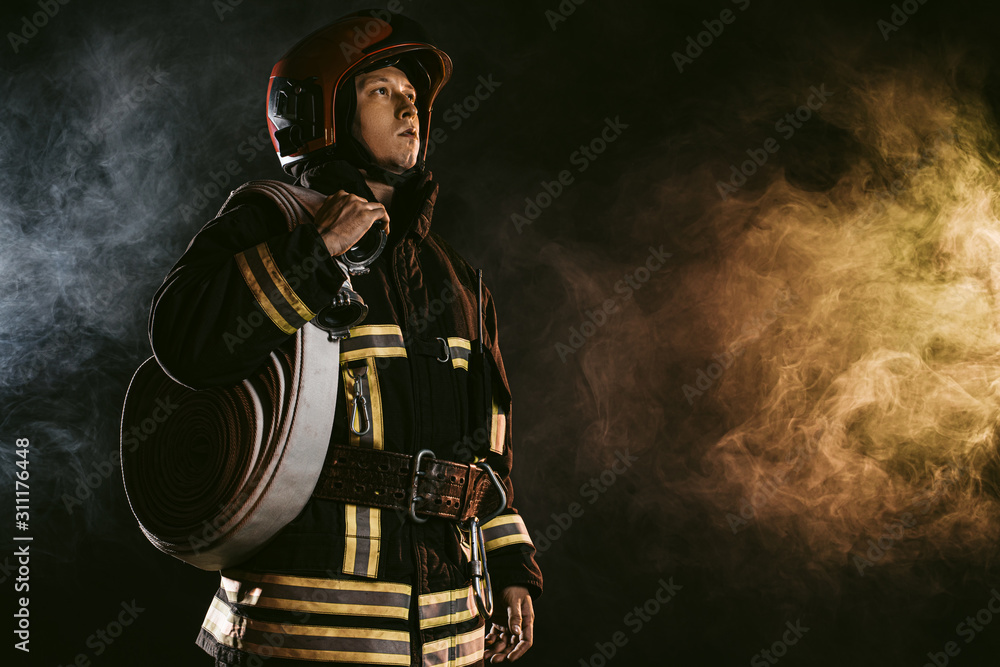 brave man fire fighter extinguishing fire, work at fire station and ...